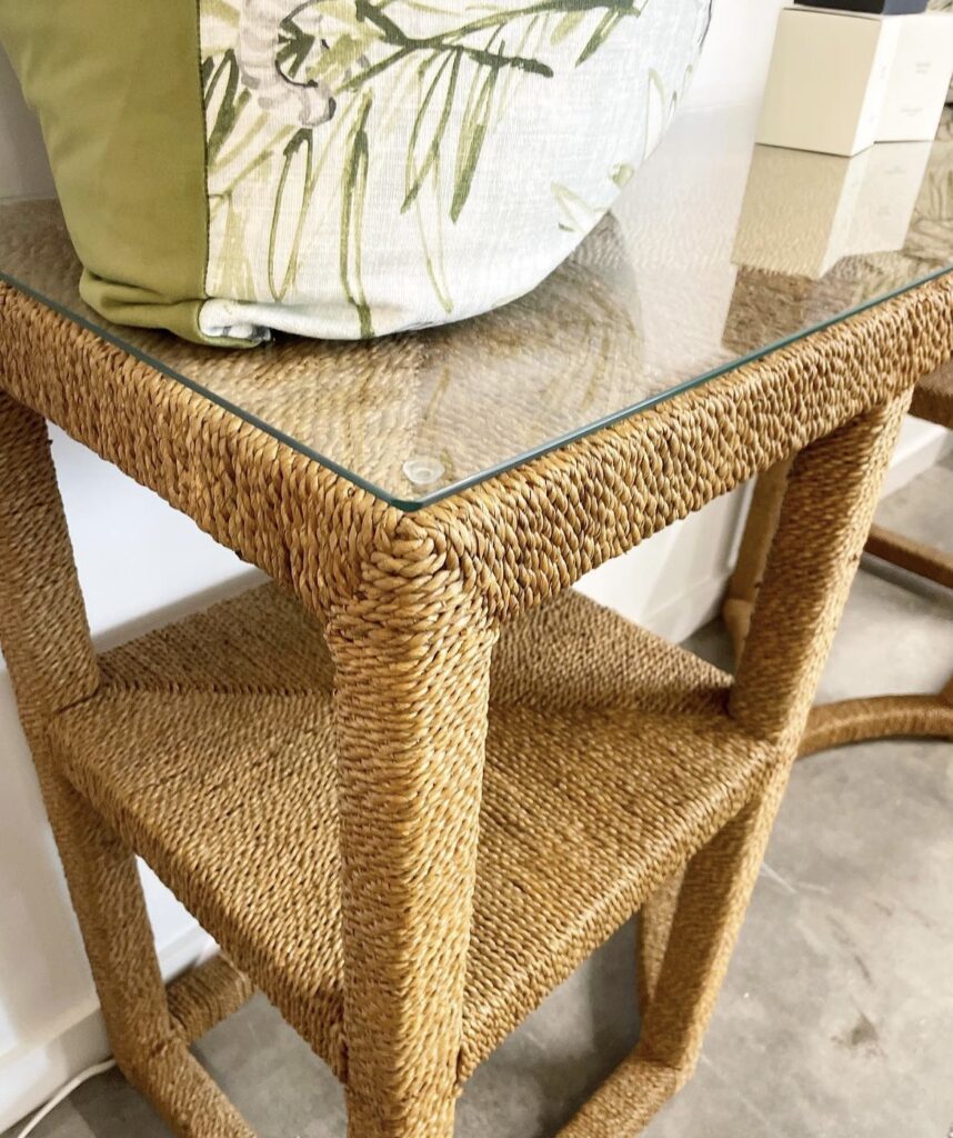 Glass top woven console table – Poppy's of Macon